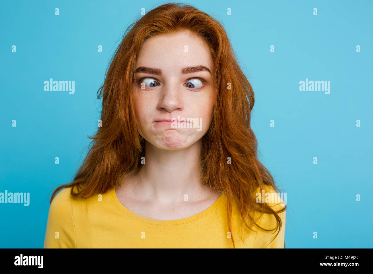 Headshot Portrait Of Happy Ginger Red Hair Girl With Funny Face Looking