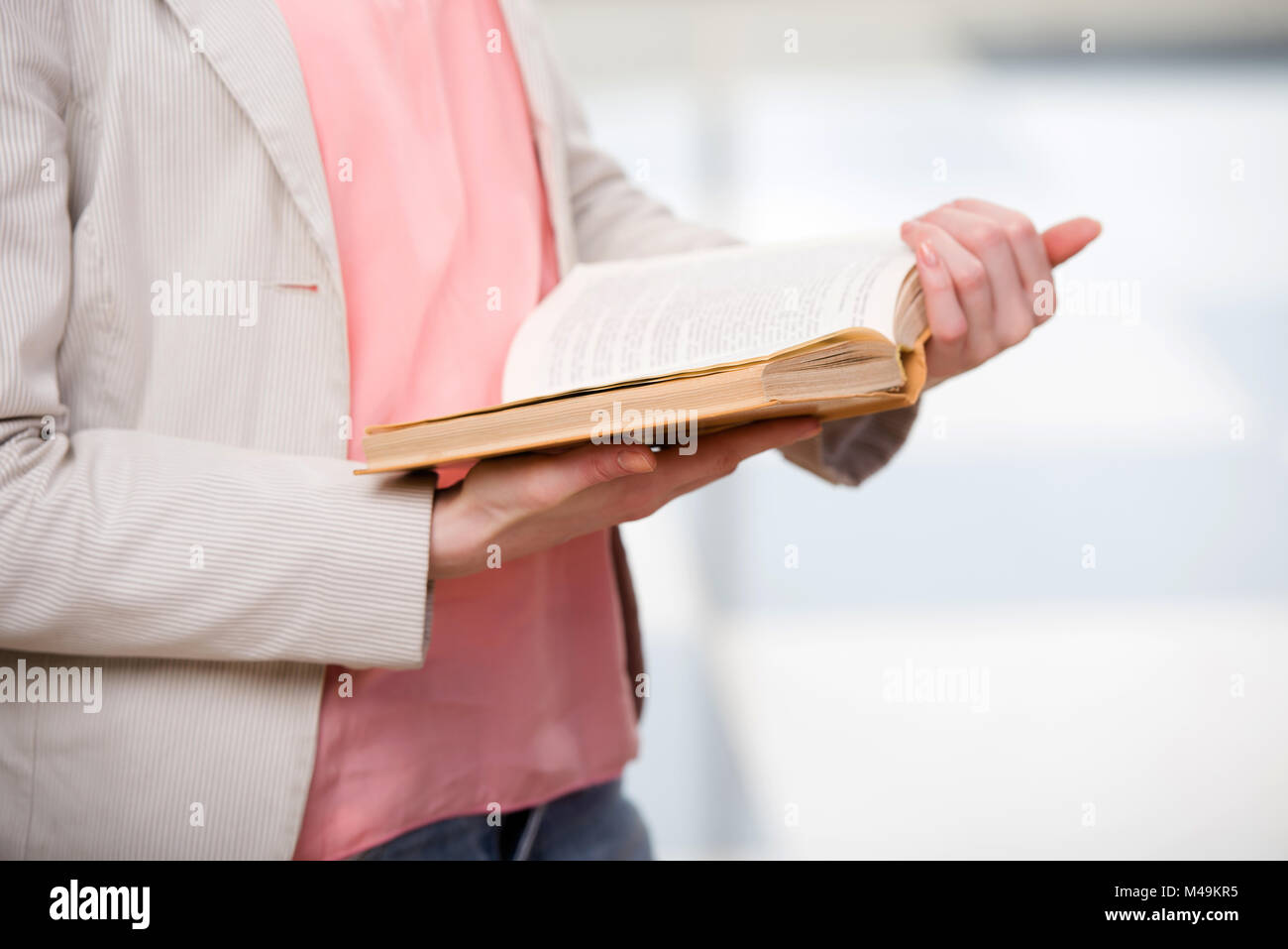 Young student reading book in preparation for exams Stock Photo - Alamy