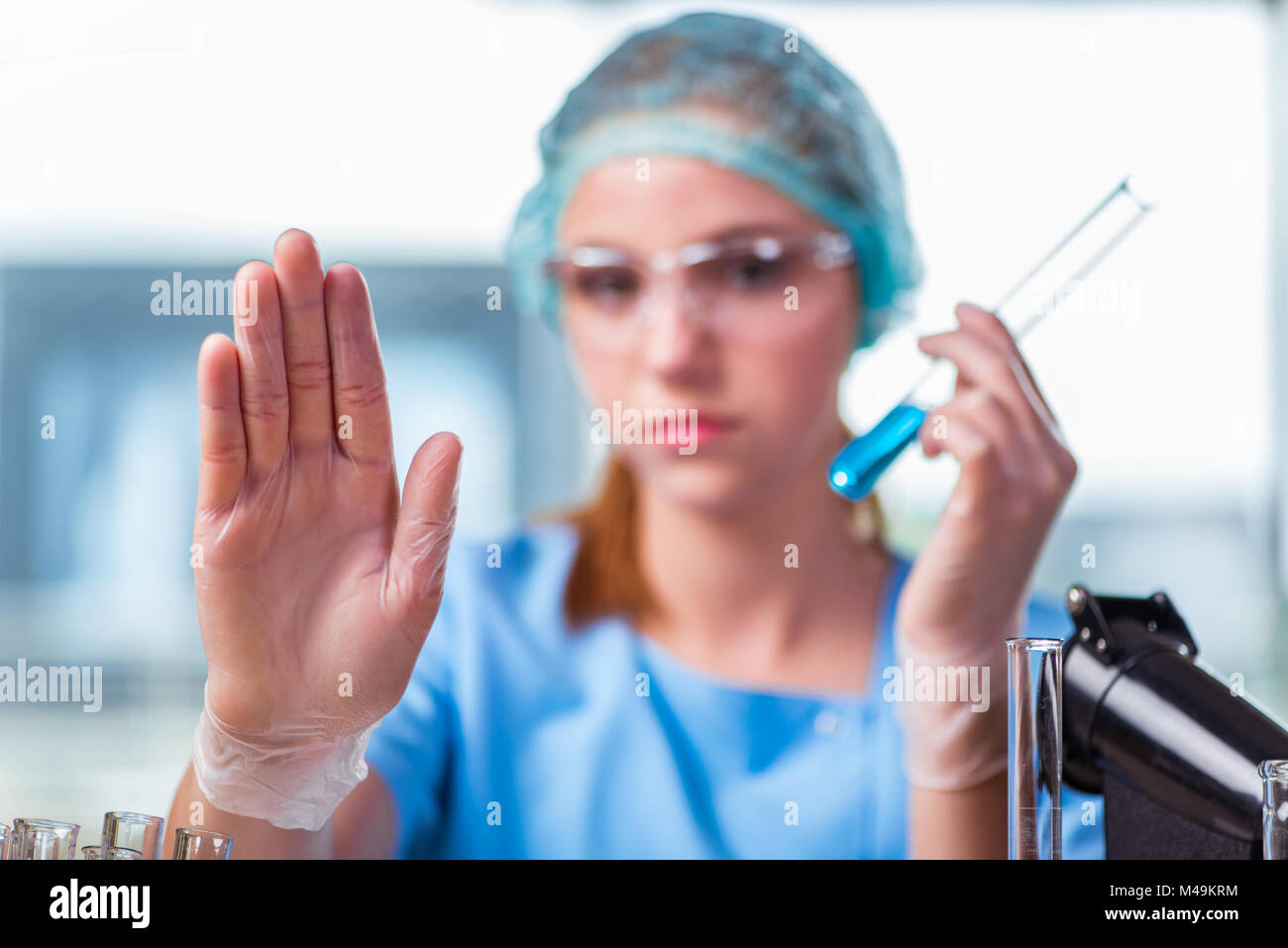 Young student working with chemical solutions in lab Stock Photo - Alamy