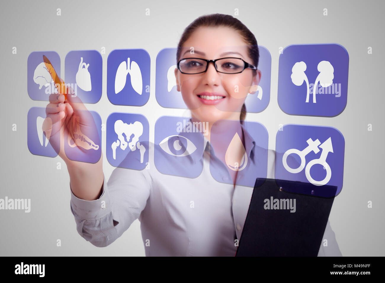 Woman doctor pressing buttons with various medical icons Stock Photo ...