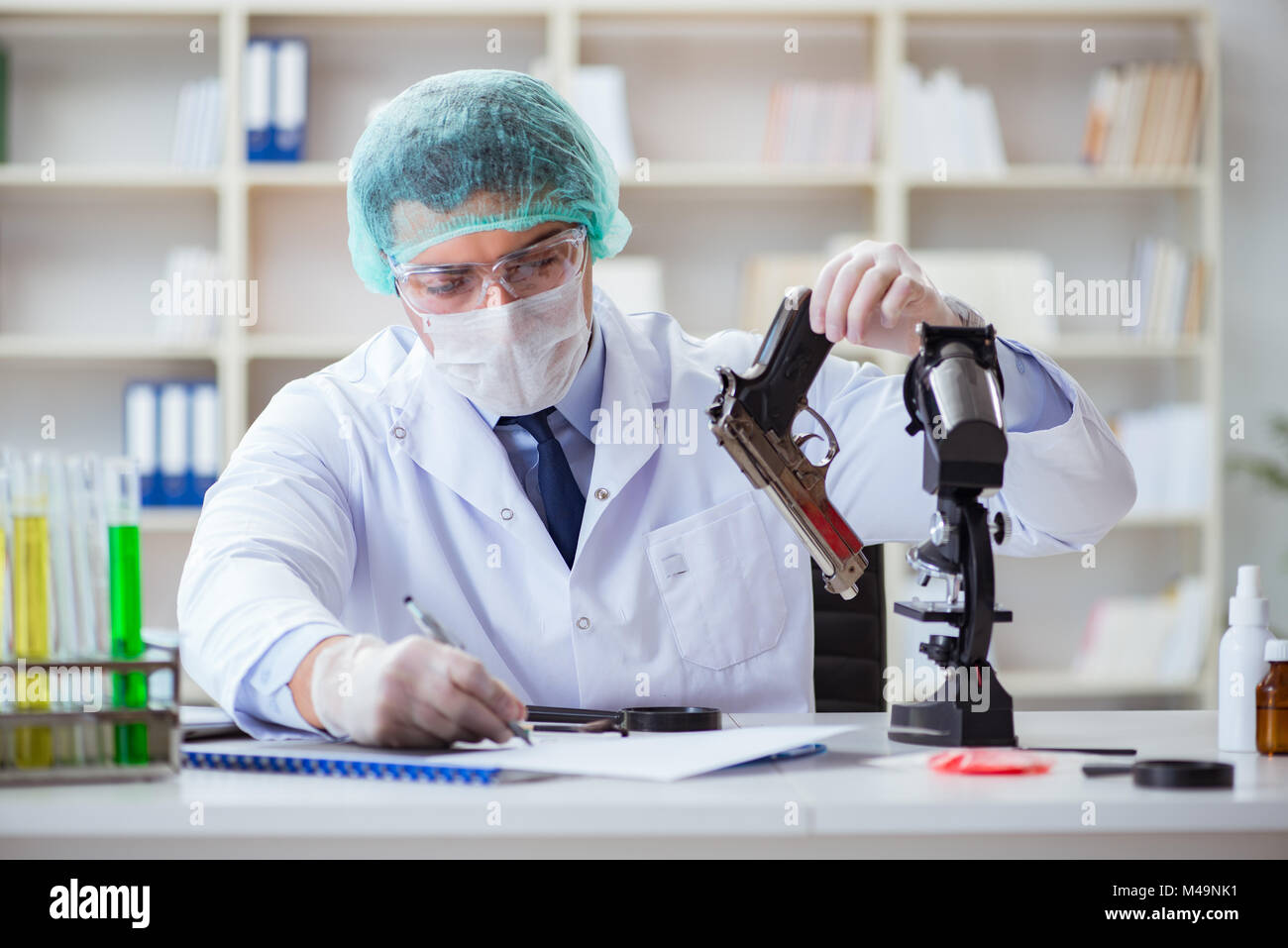 Forensics investigator working in lab on crime evidence Stock Photo - Alamy