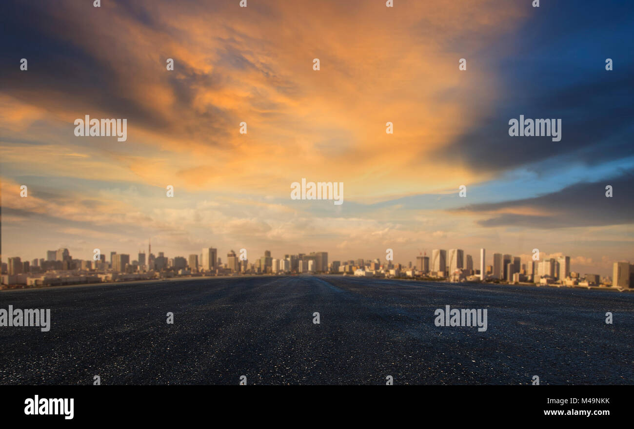 sport man running on asphalt road with sunset sky and urban scene ...