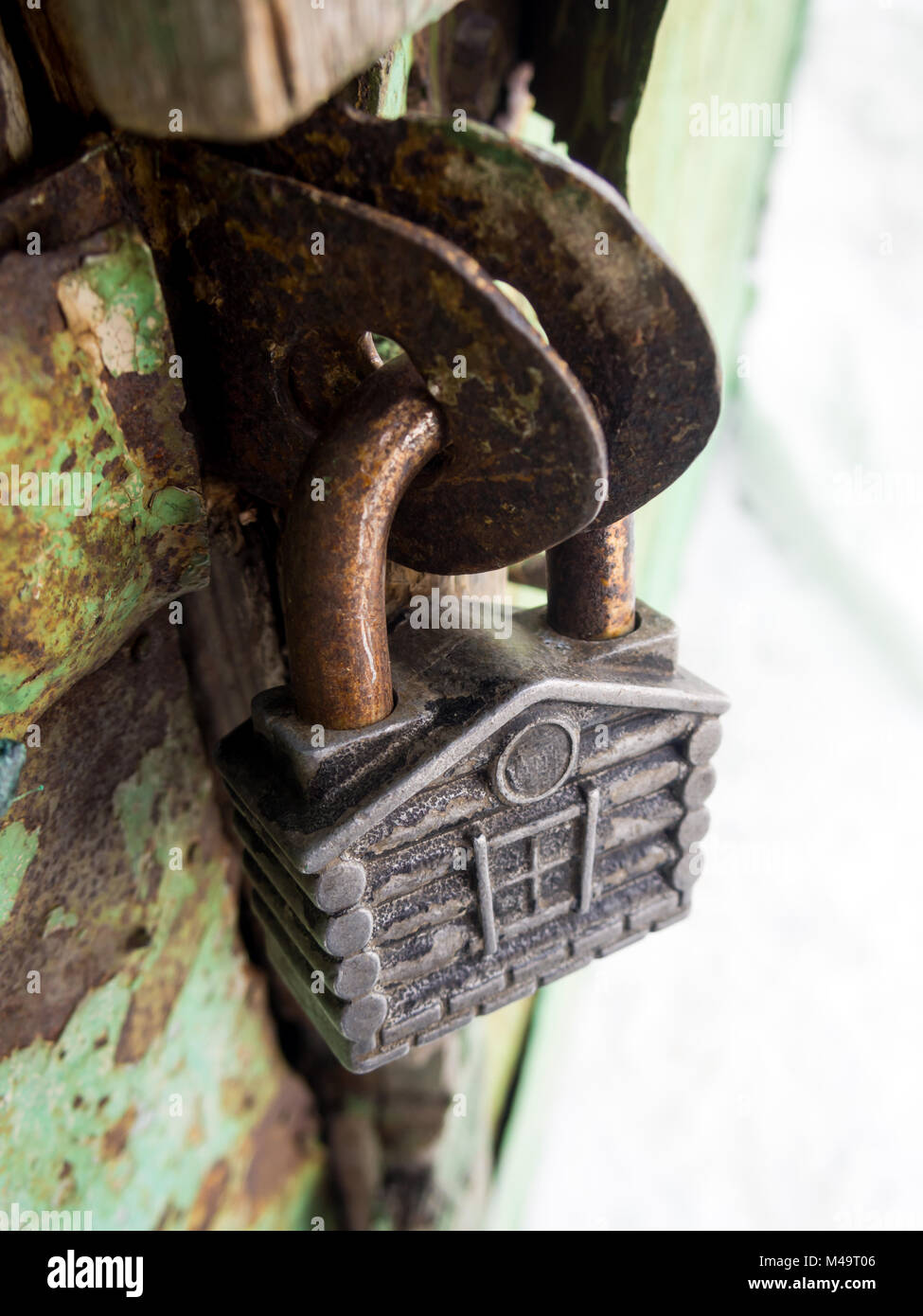 Vintage door lock in the form of a small house on the old doors Stock ...