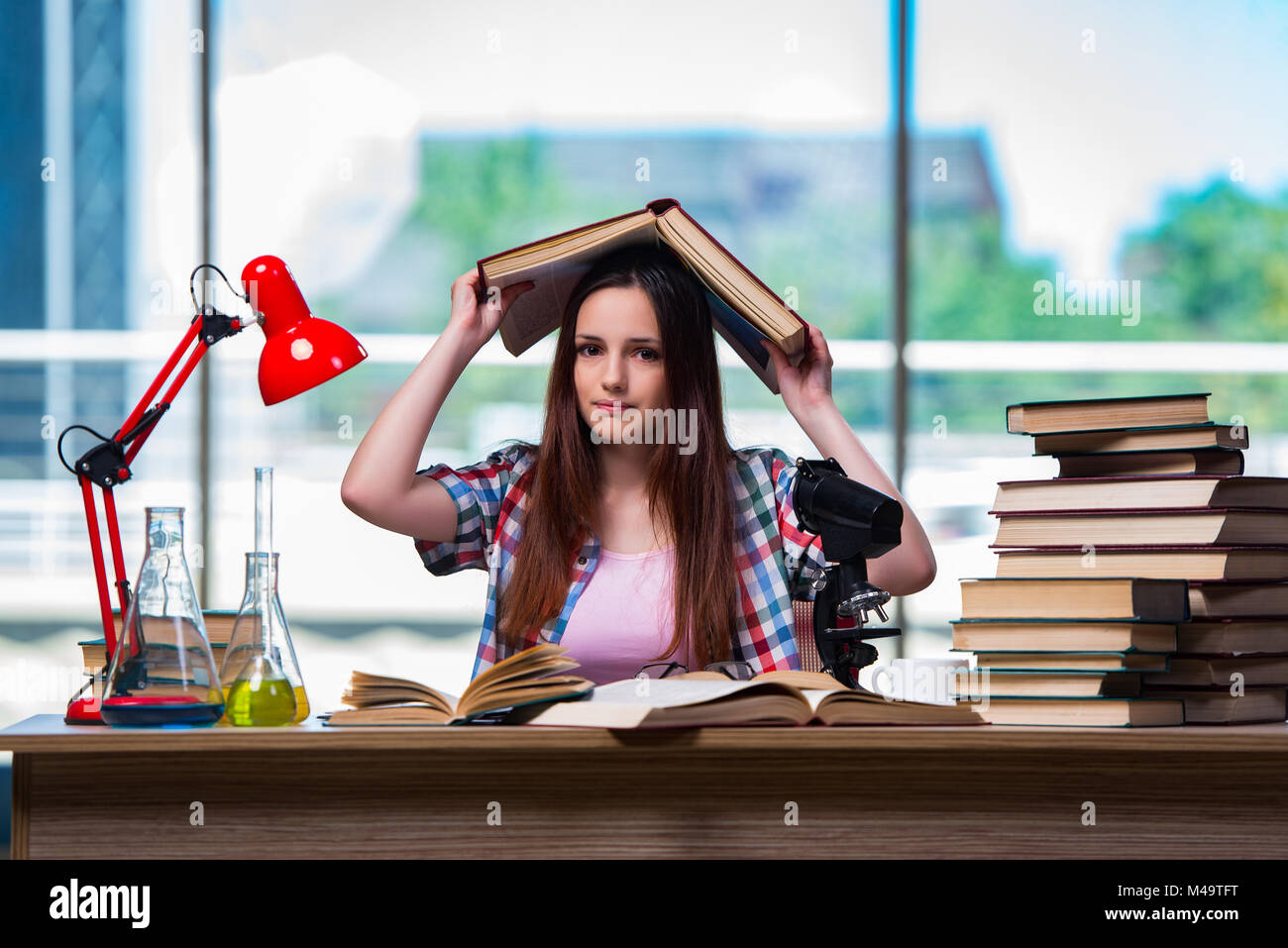 Female student preparing for chemistry exams Stock Photo - Alamy
