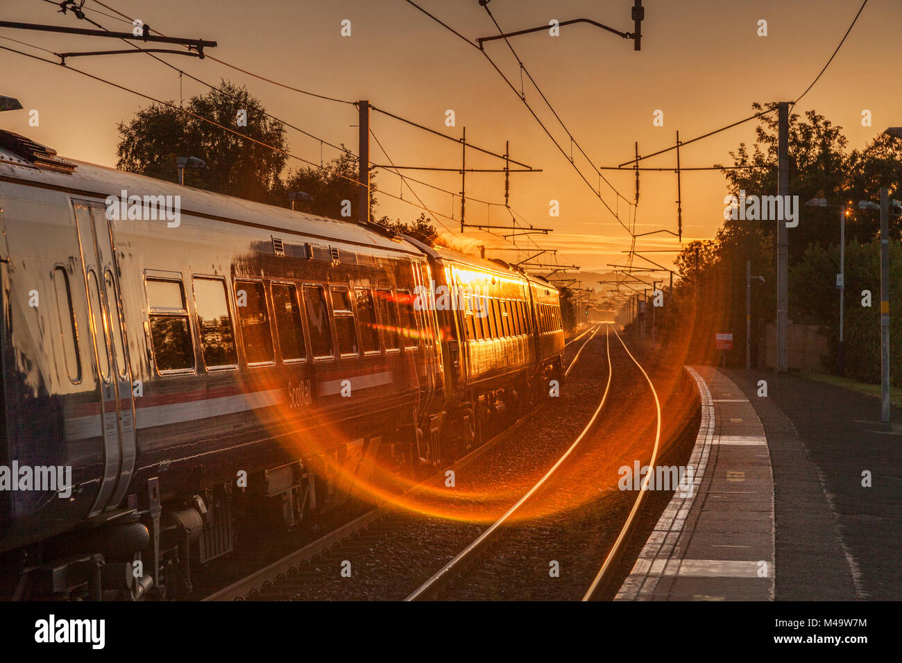 ScotRail train at station, early morning Stock Photo - Alamy
