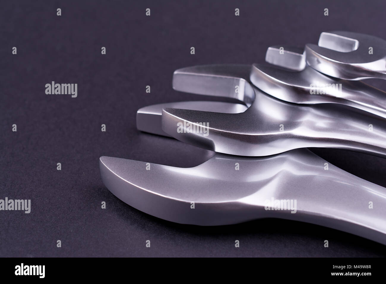 Set of wrenches on black background Stock Photo - Alamy