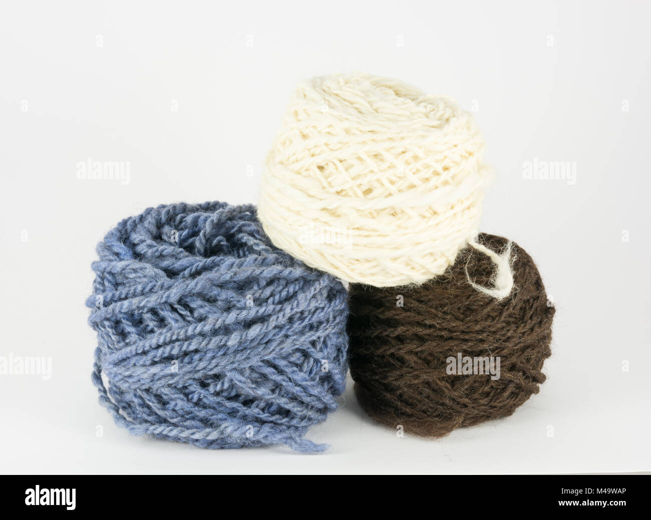 Balls of wool on a white background Stock Photo - Alamy