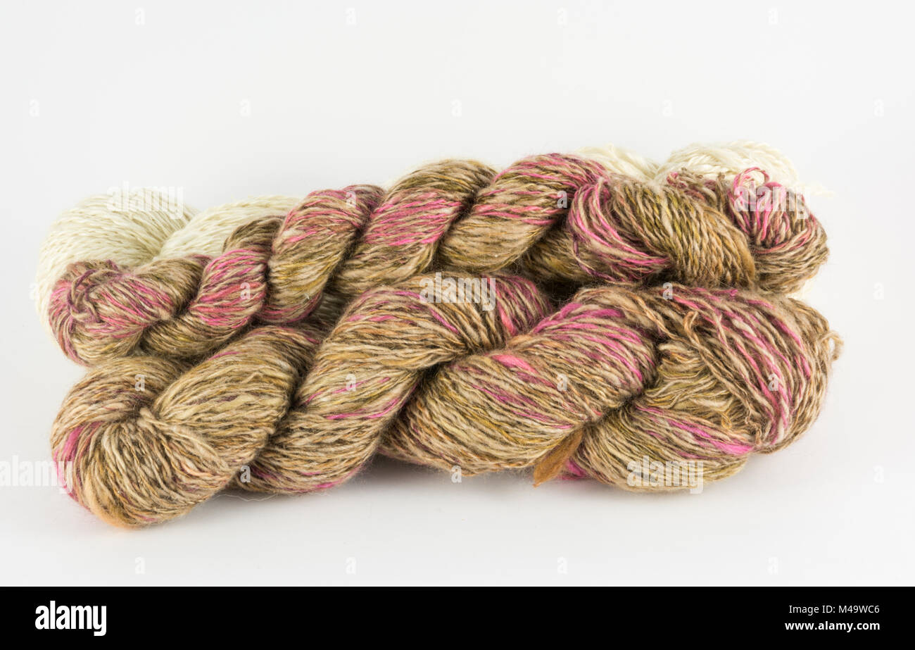 Hanks of hand spun wool on a white background Stock Photo - Alamy