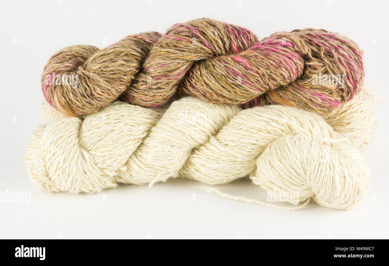 Hanks of hand spun wool on a white background Stock Photo - Alamy