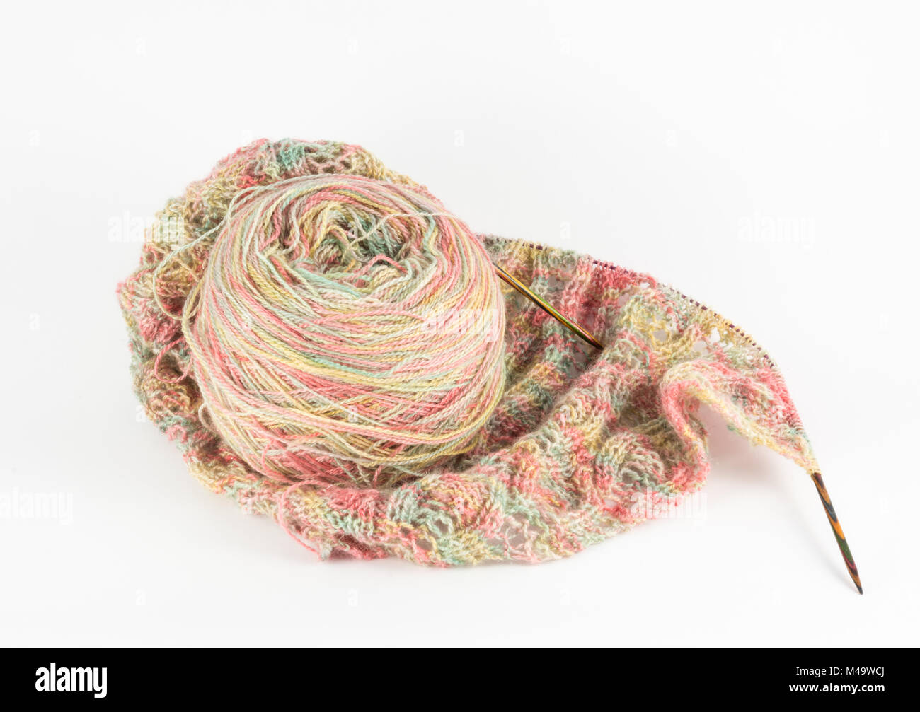 Knitting and a ball of wool on a white background Stock Photo - Alamy