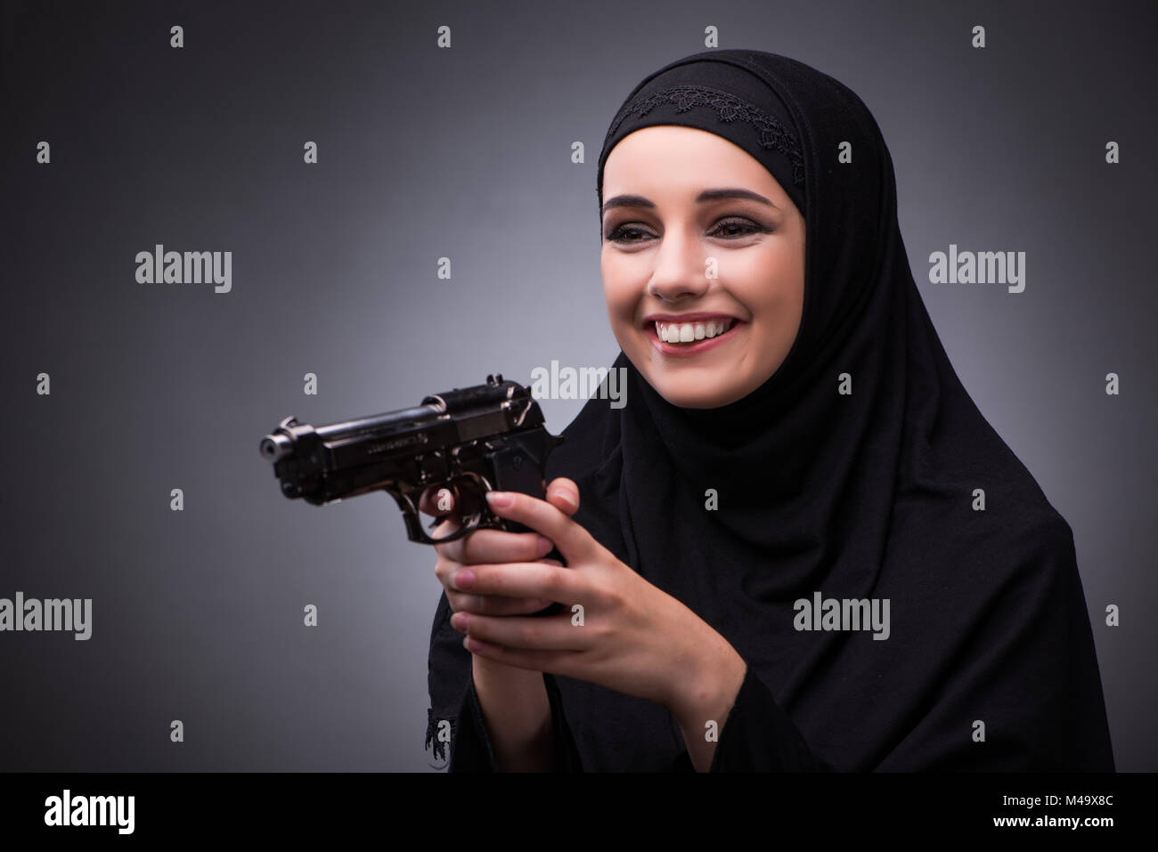 Muslim woman with gun hi-res stock photography and images - Alamy