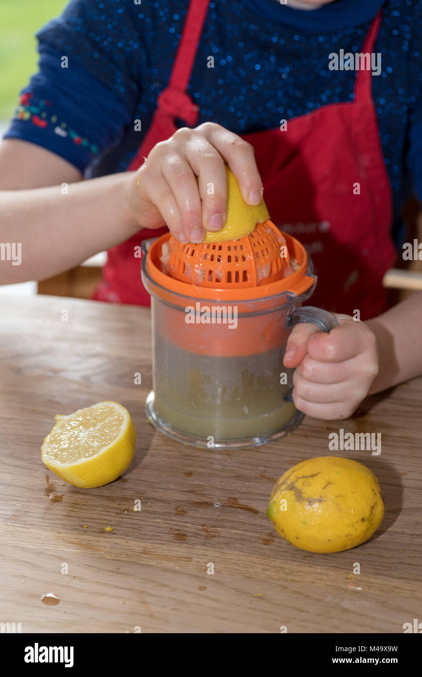 Lemon squeezing child hi-res stock photography and images - Alamy