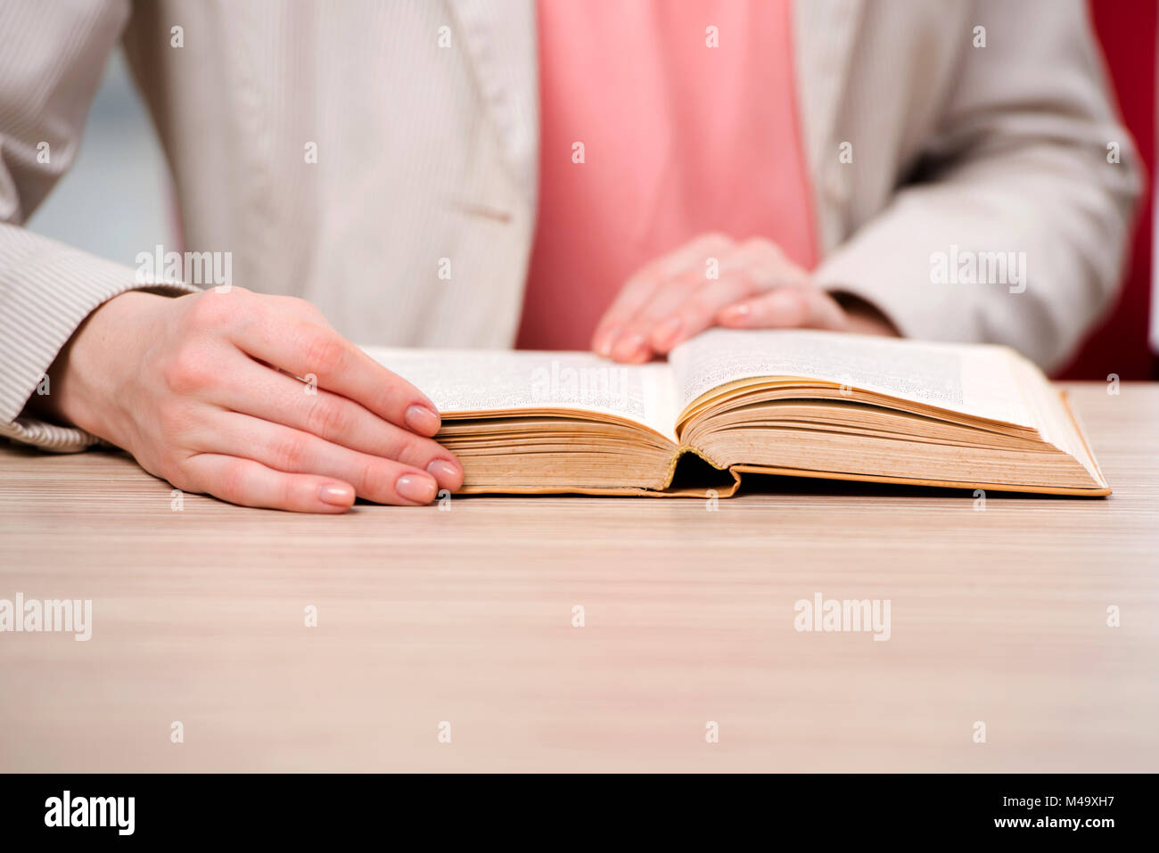 Young student reading book in preparation for exams Stock Photo - Alamy