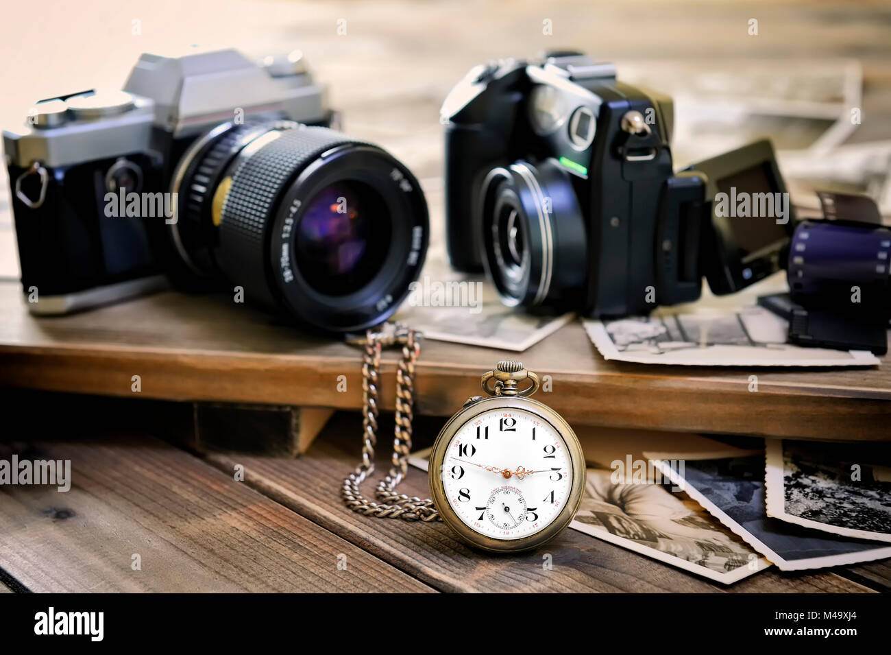 Close up antique pocket watch, vintage photographic prints, film camera ...