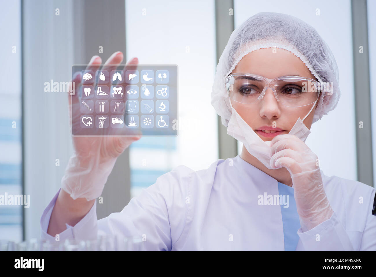 Woman doctor pressing buttons with various medical icons Stock Photo ...