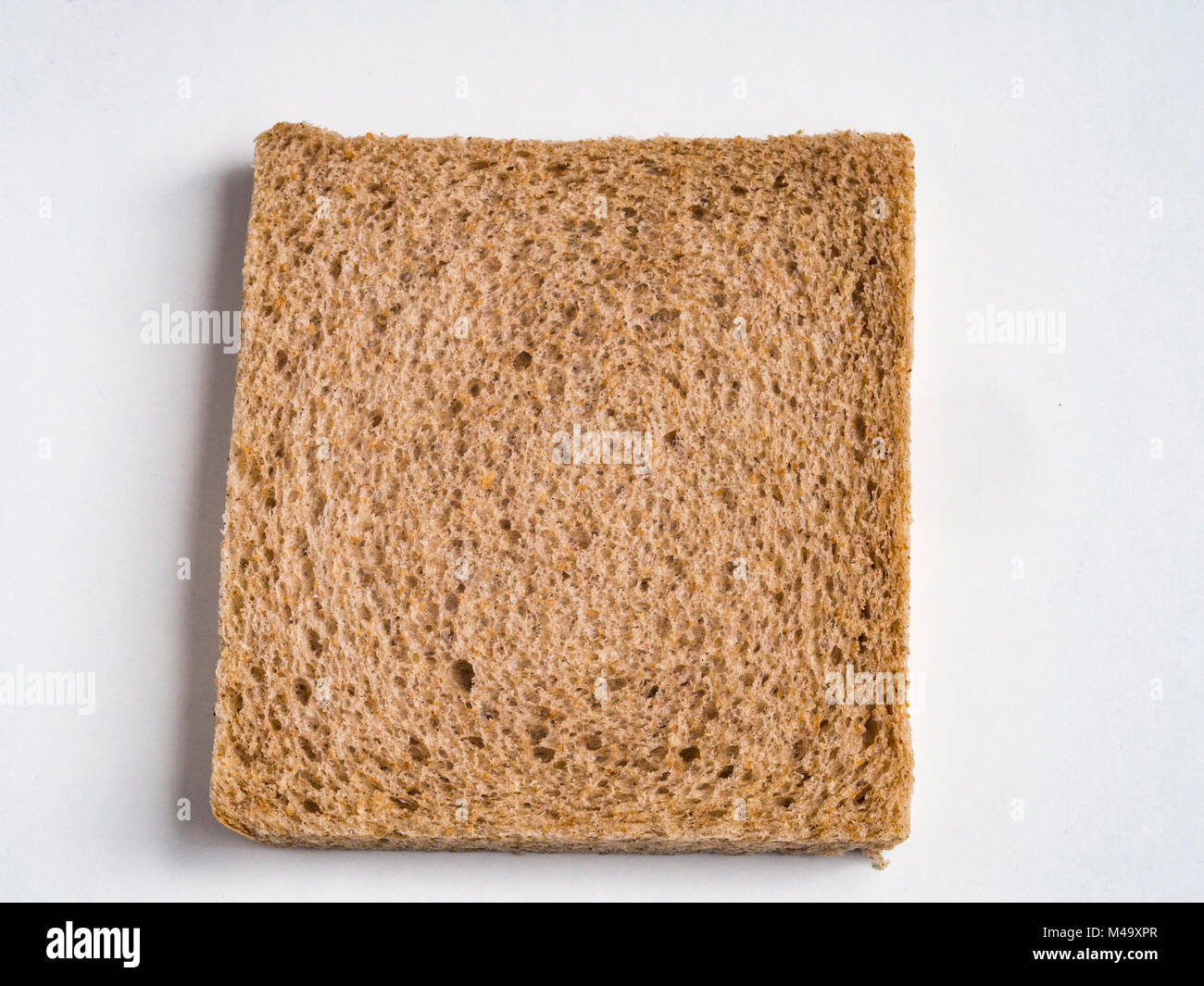 Wholemeal bread without crust on white background Stock Photo - Alamy