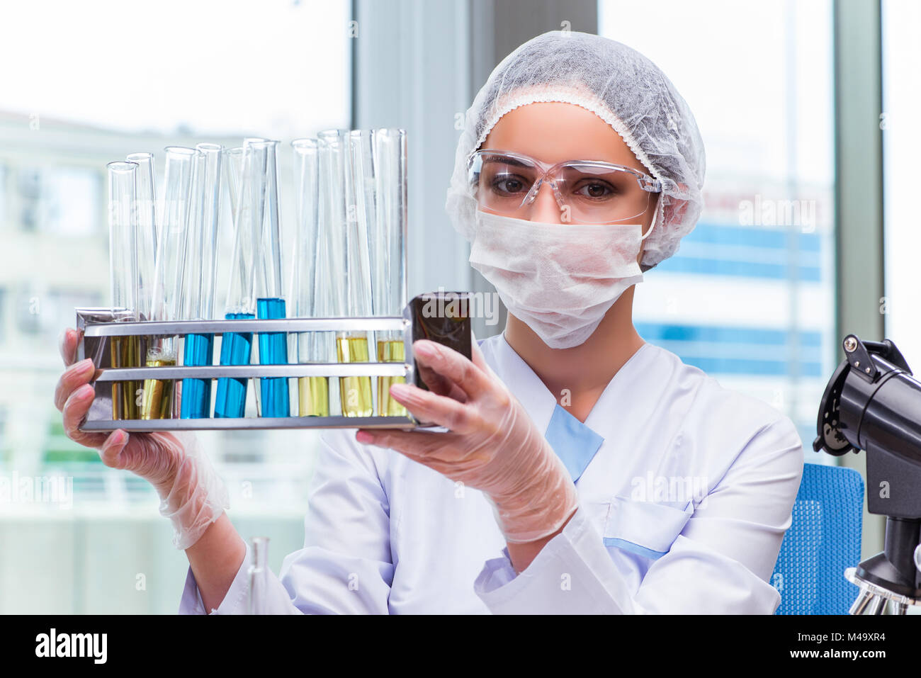 Young student working with chemical solutions in lab Stock Photo - Alamy