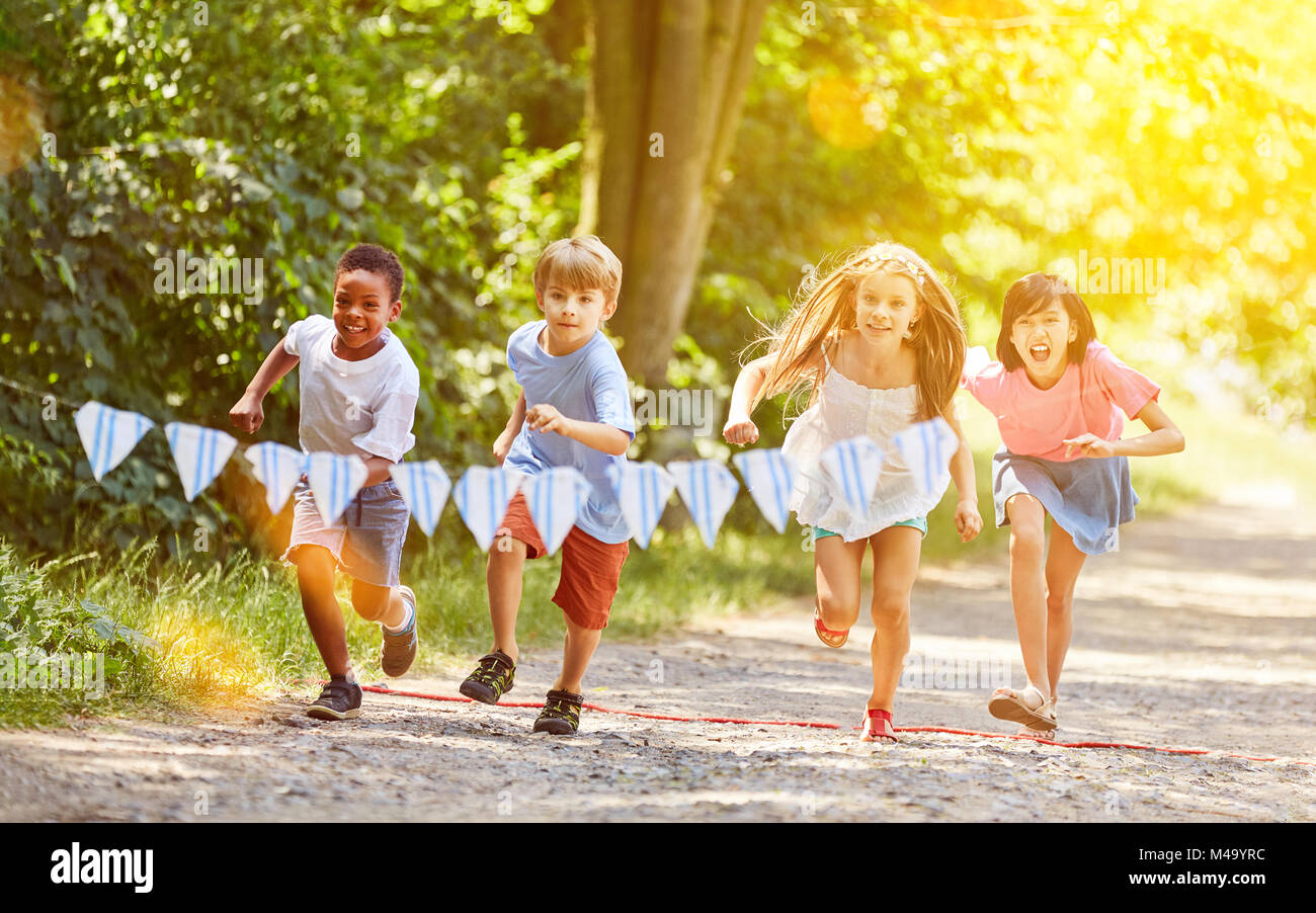 Group of kids makes race competition in summer in the garden Stock ...