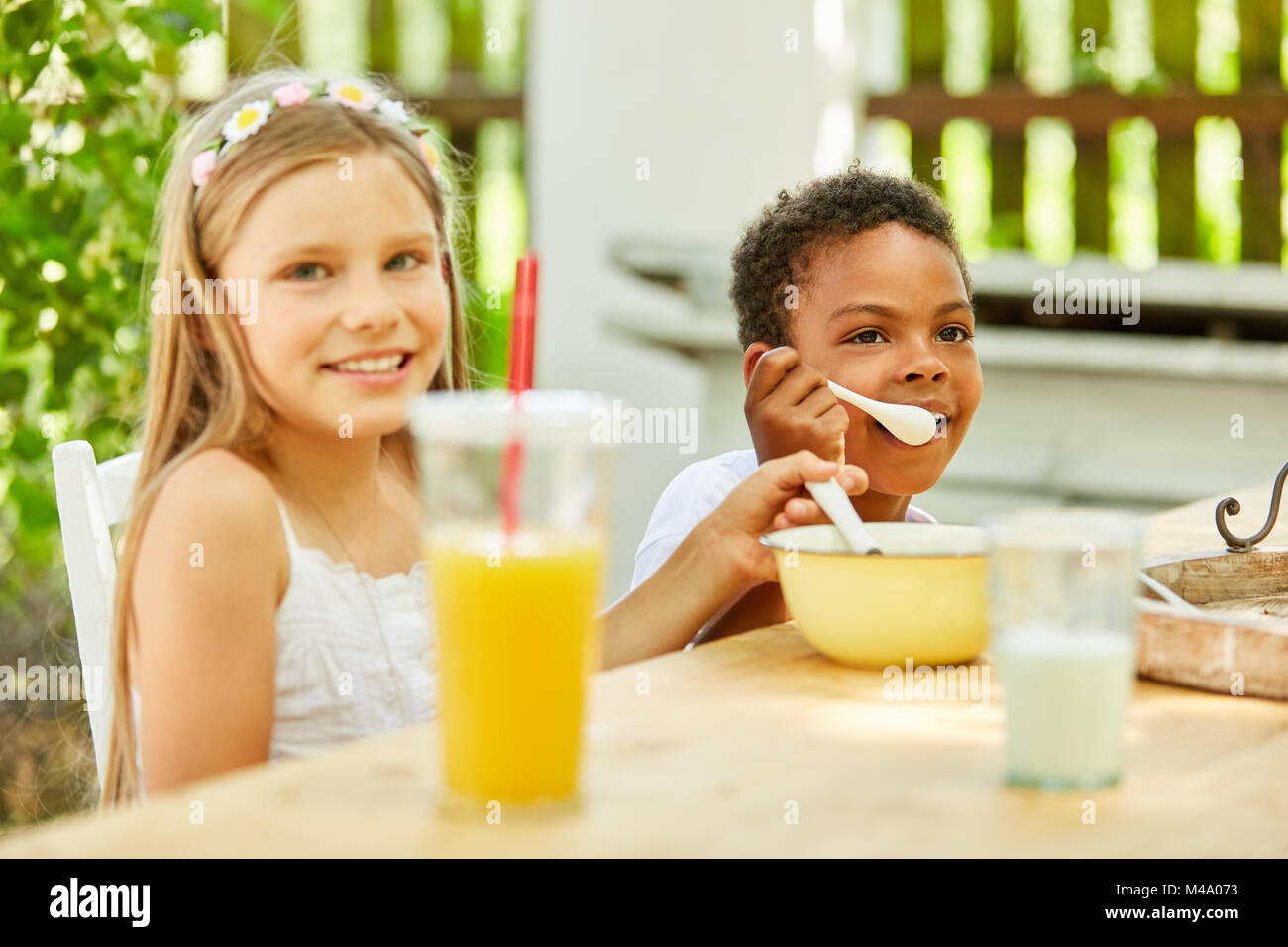 African boy and a girl together at breakfast Stock Photo - Alamy