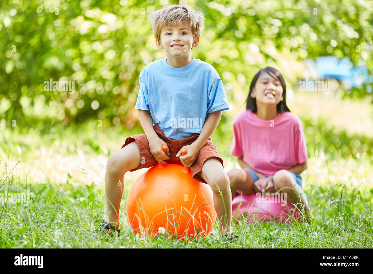 Girl jumping ball hi-res stock photography and images - Alamy