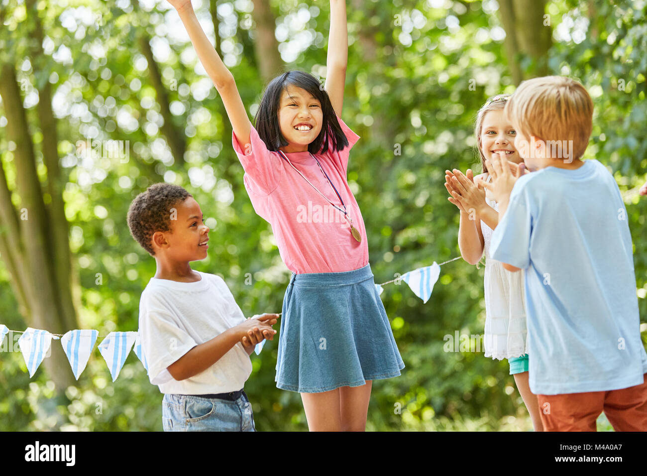 Cheering girl as winner at the award ceremony with friends Stock Photo ...