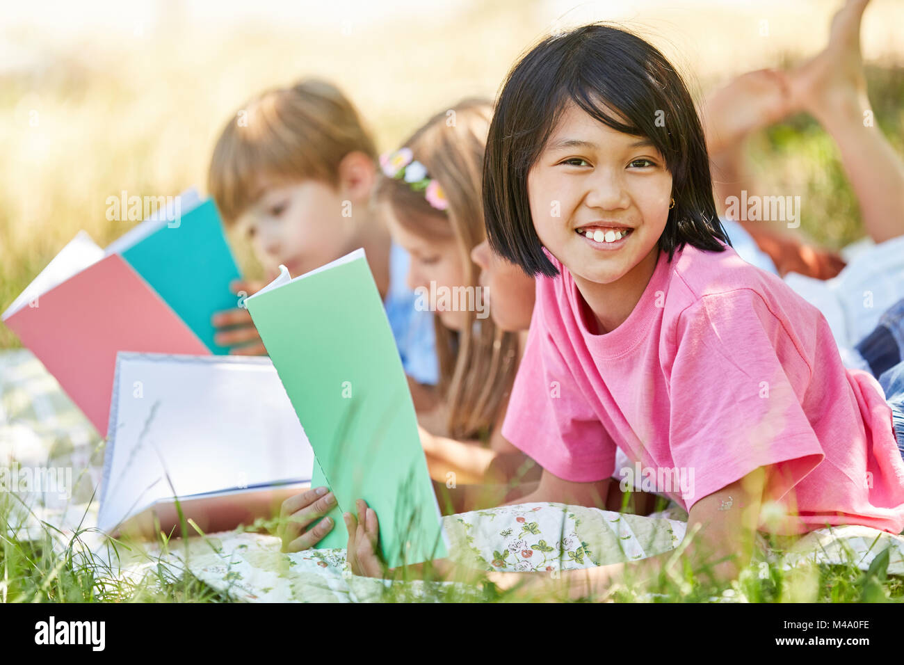 Asian girl together with friends while learning in the great outdoors ...