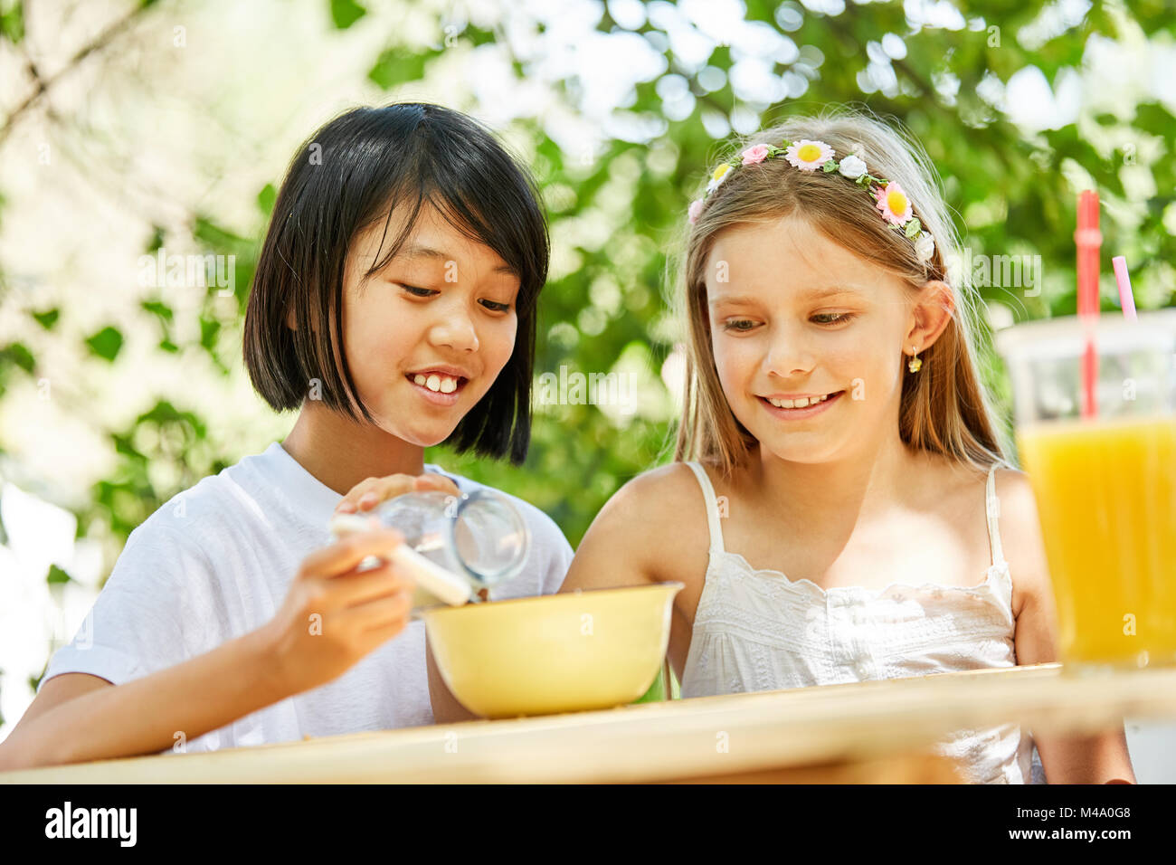 Two girls as best friends together at breakfast in summer camp Stock ...