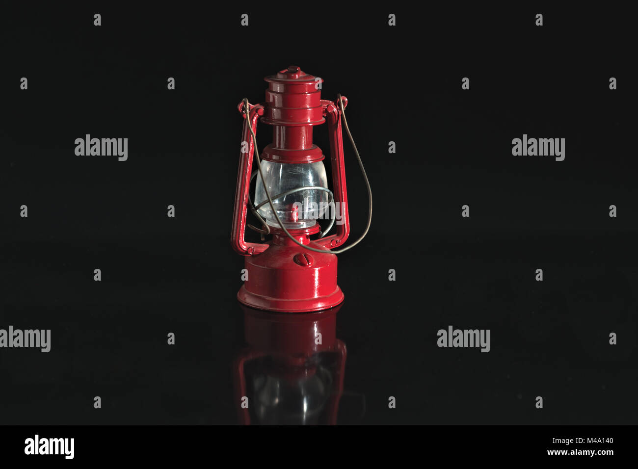 miniature red lantern on black background Stock Photo - Alamy