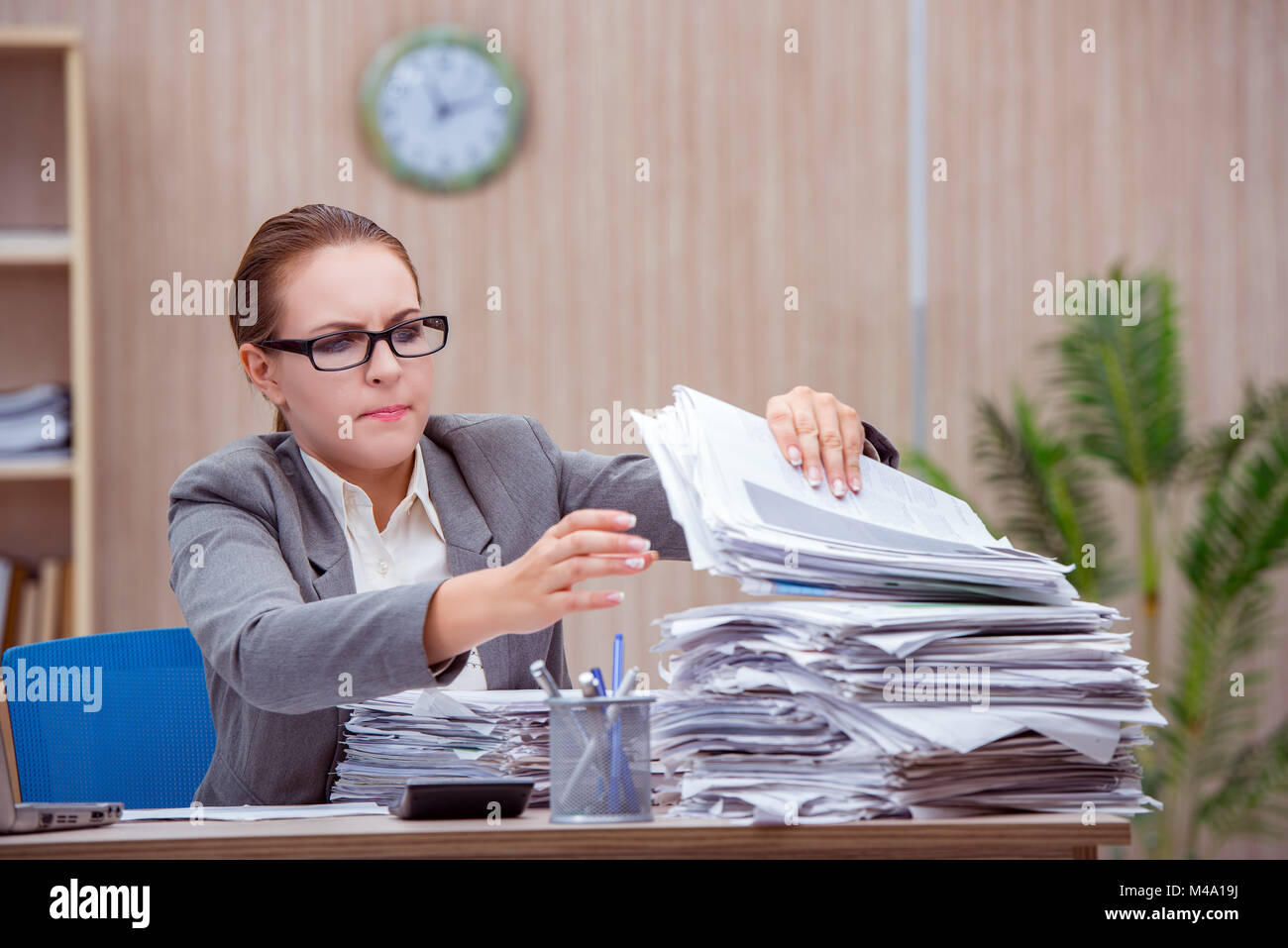 Busy stressful woman secretary under stress in the office Stock Photo ...