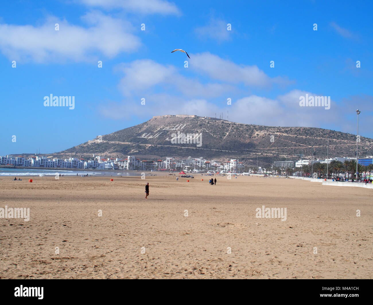 Sandy beach in travel AGADIR city in MOROCCO landscapes, clear blue sky ...