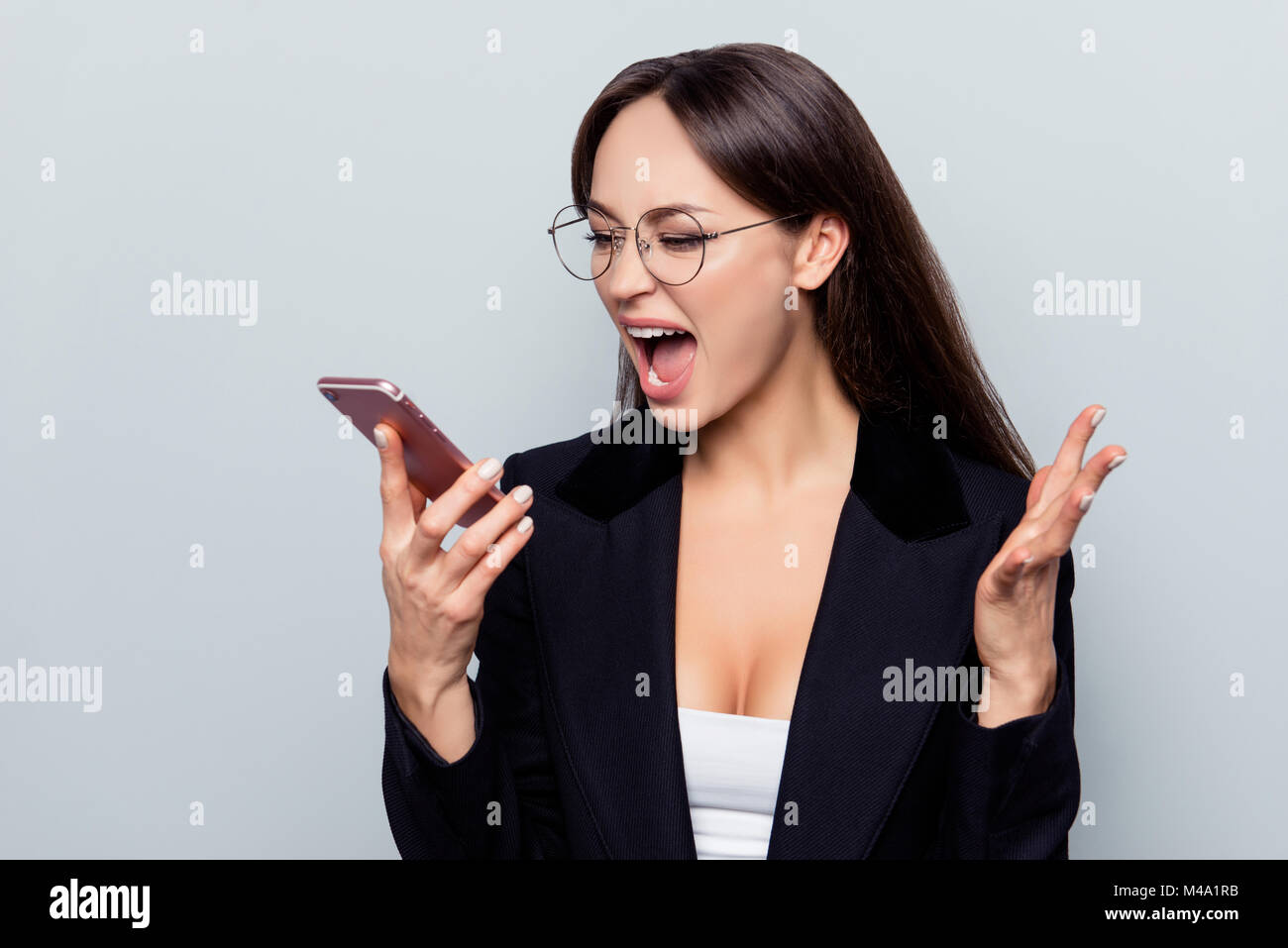 Portrait of frustrated, mad, crazy employer in formal wear, blach ...