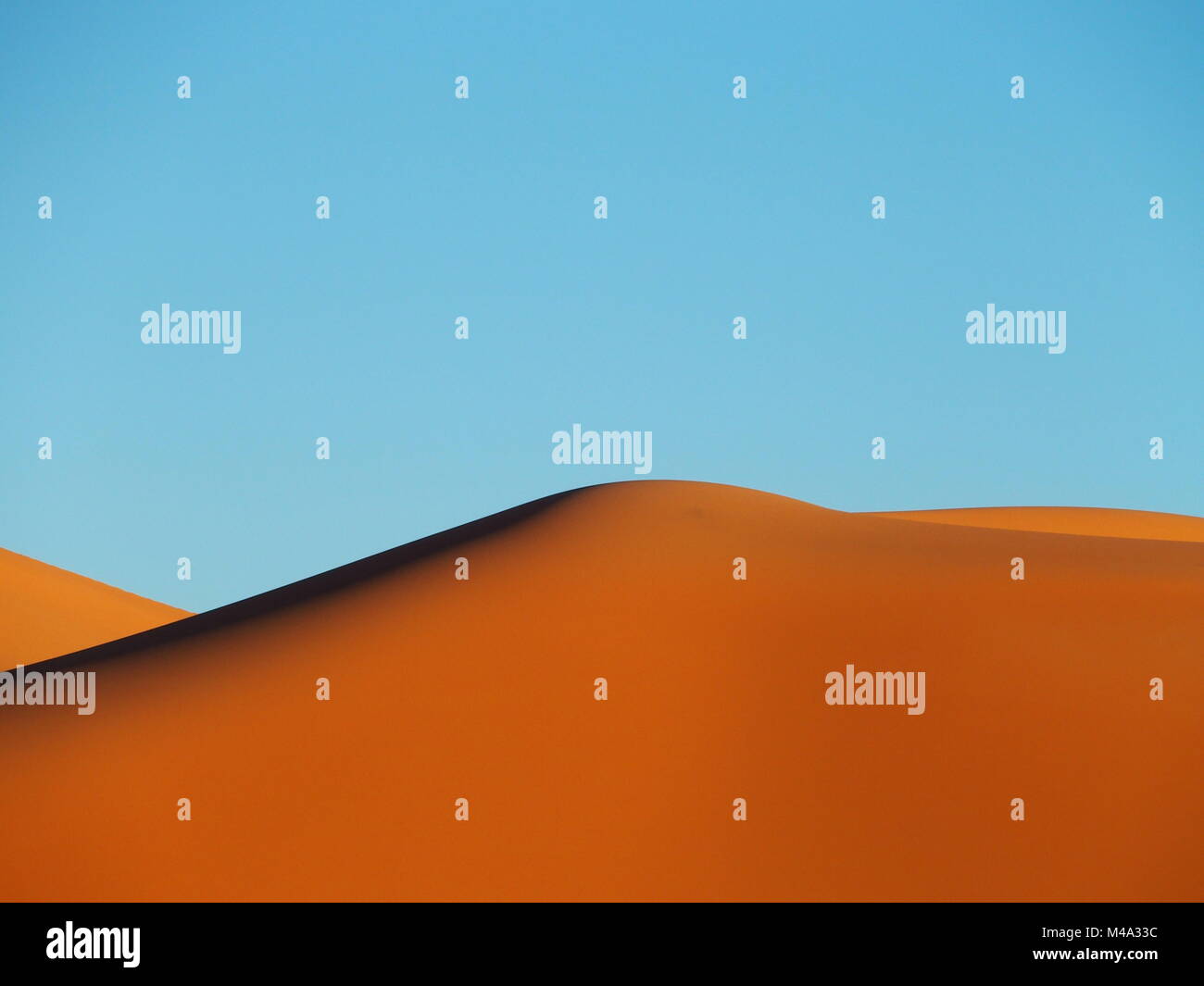 Peak of ERG CHEBBI dunes near MERZOUGA with landscapes of sandy desert ...