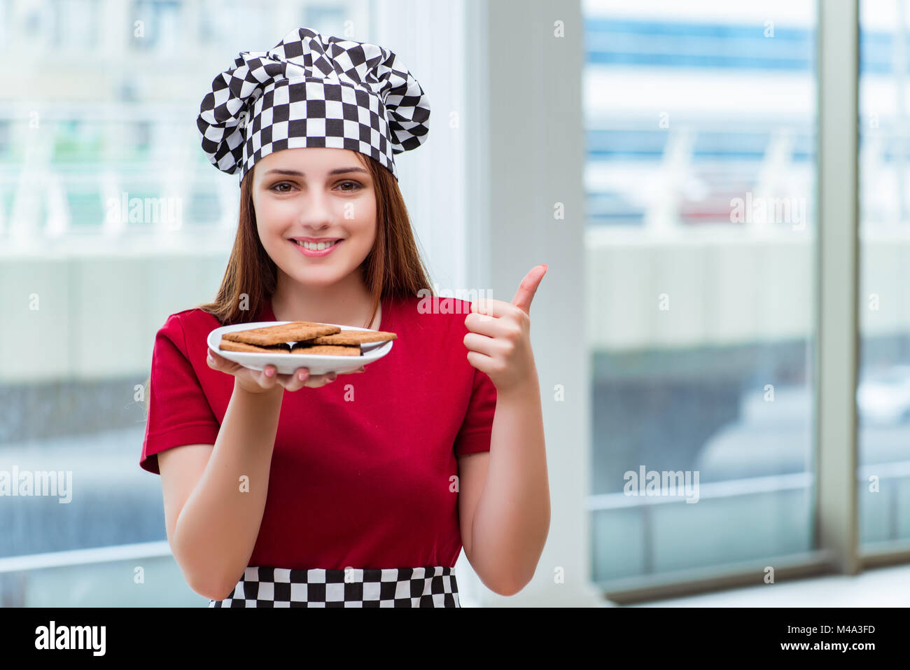 Young cook preparing cookies in the kitchen Stock Photo - Alamy