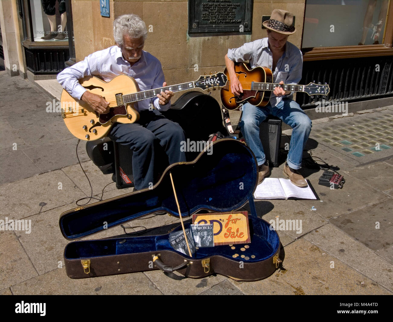 Busking guitars hi-res stock photography and images - Alamy