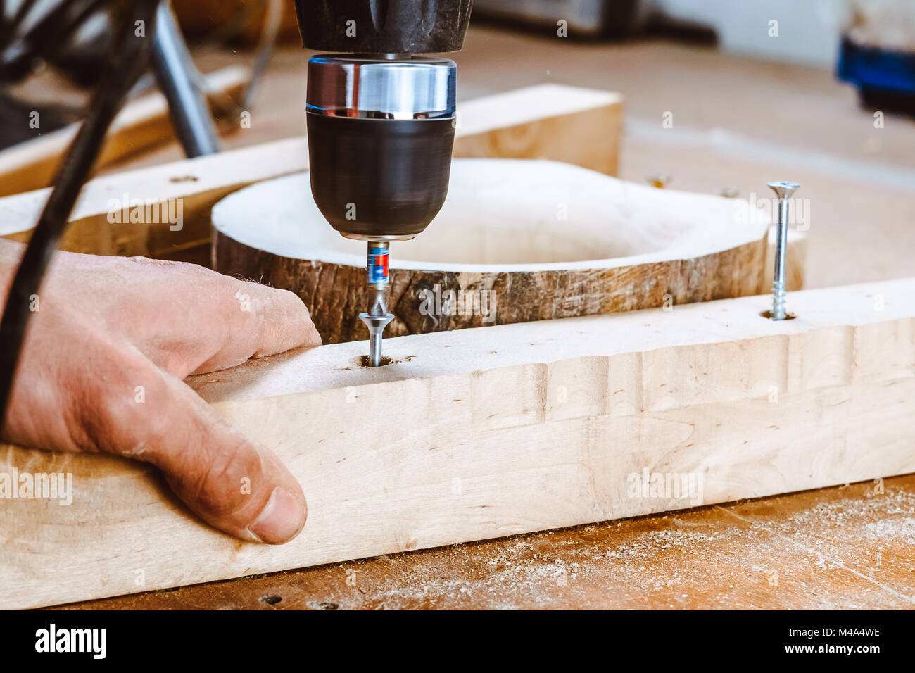tighten the screw into the tree Stock Photo - Alamy