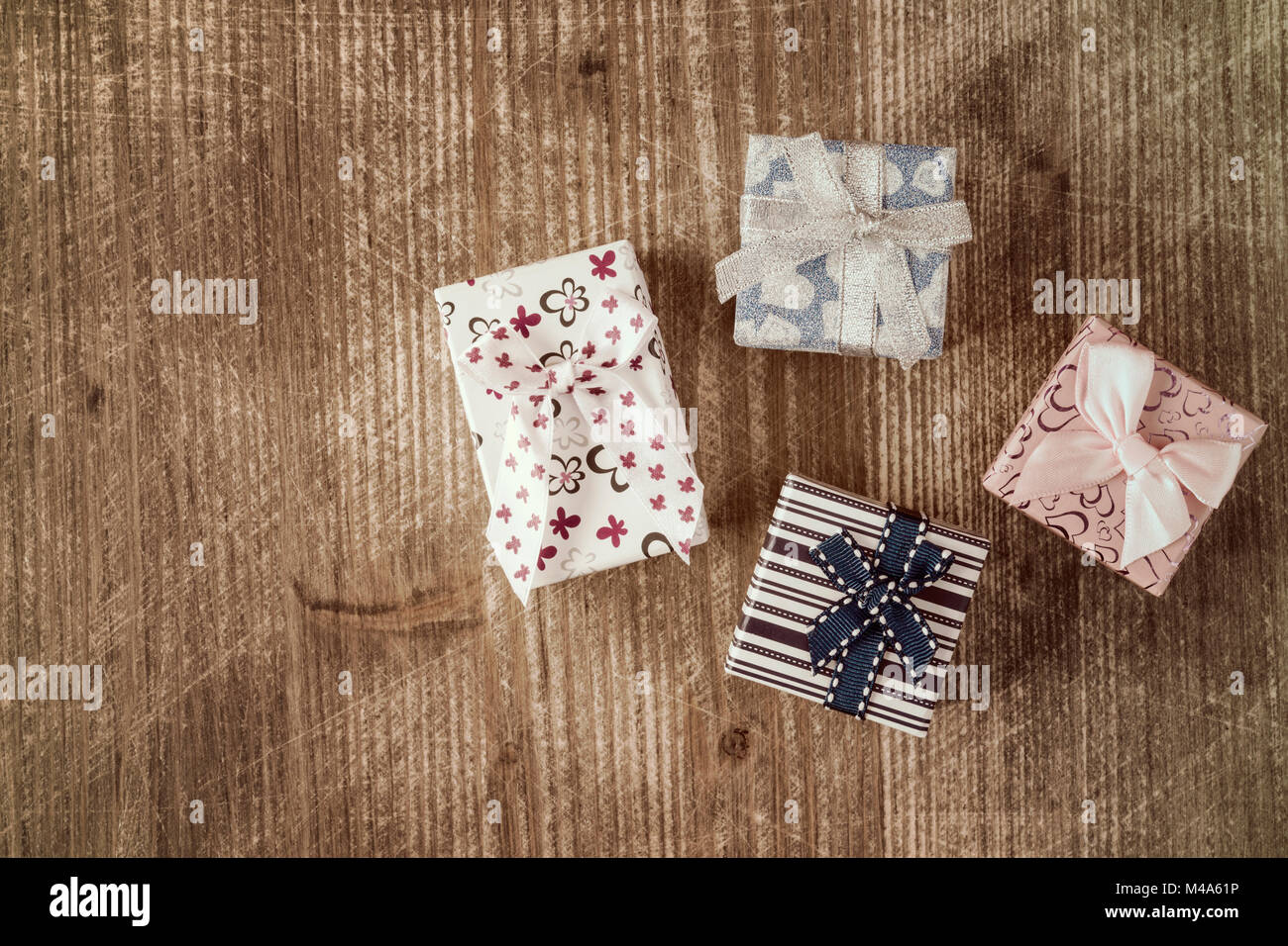 Top view of various gift boxes on wooden table Stock Photo - Alamy