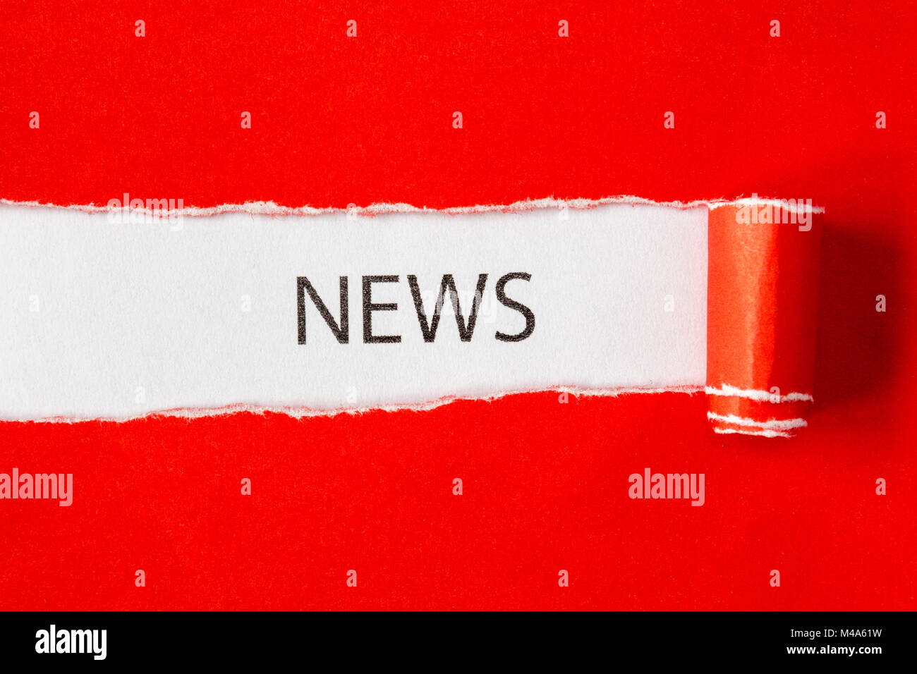 Word NEWS written under torn red paper Stock Photo - Alamy