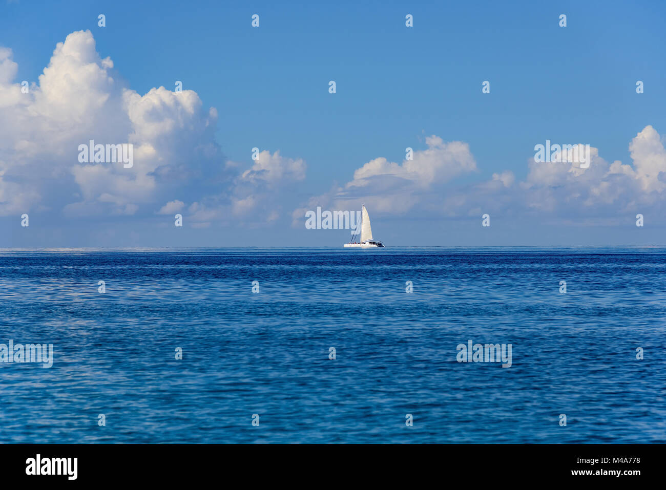 sailing boat floating in the sea near the shore Stock Photo - Alamy