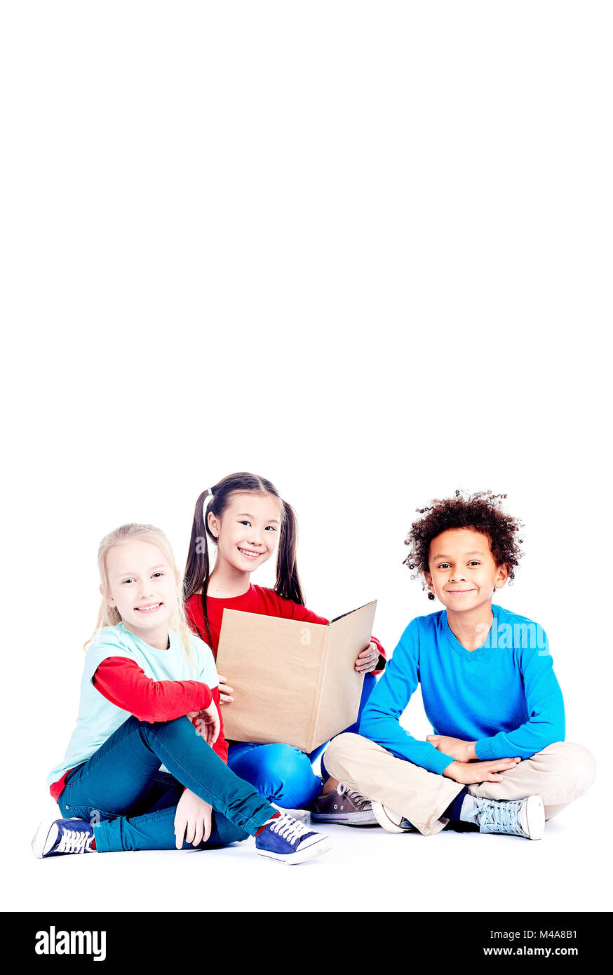 Diverse Children Reading Book Cut Out Stock Images & Pictures - Alamy