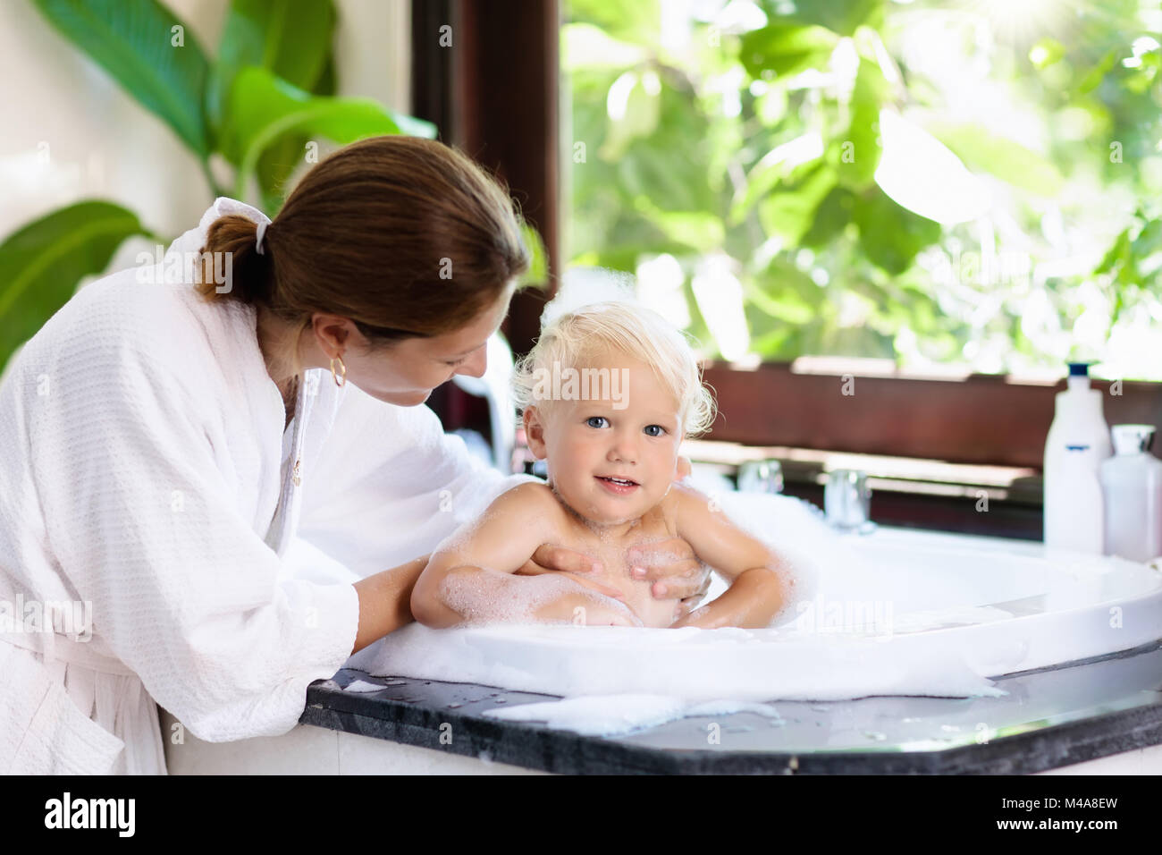 Mother taking shower baby hi-res stock photography and images - Alamy