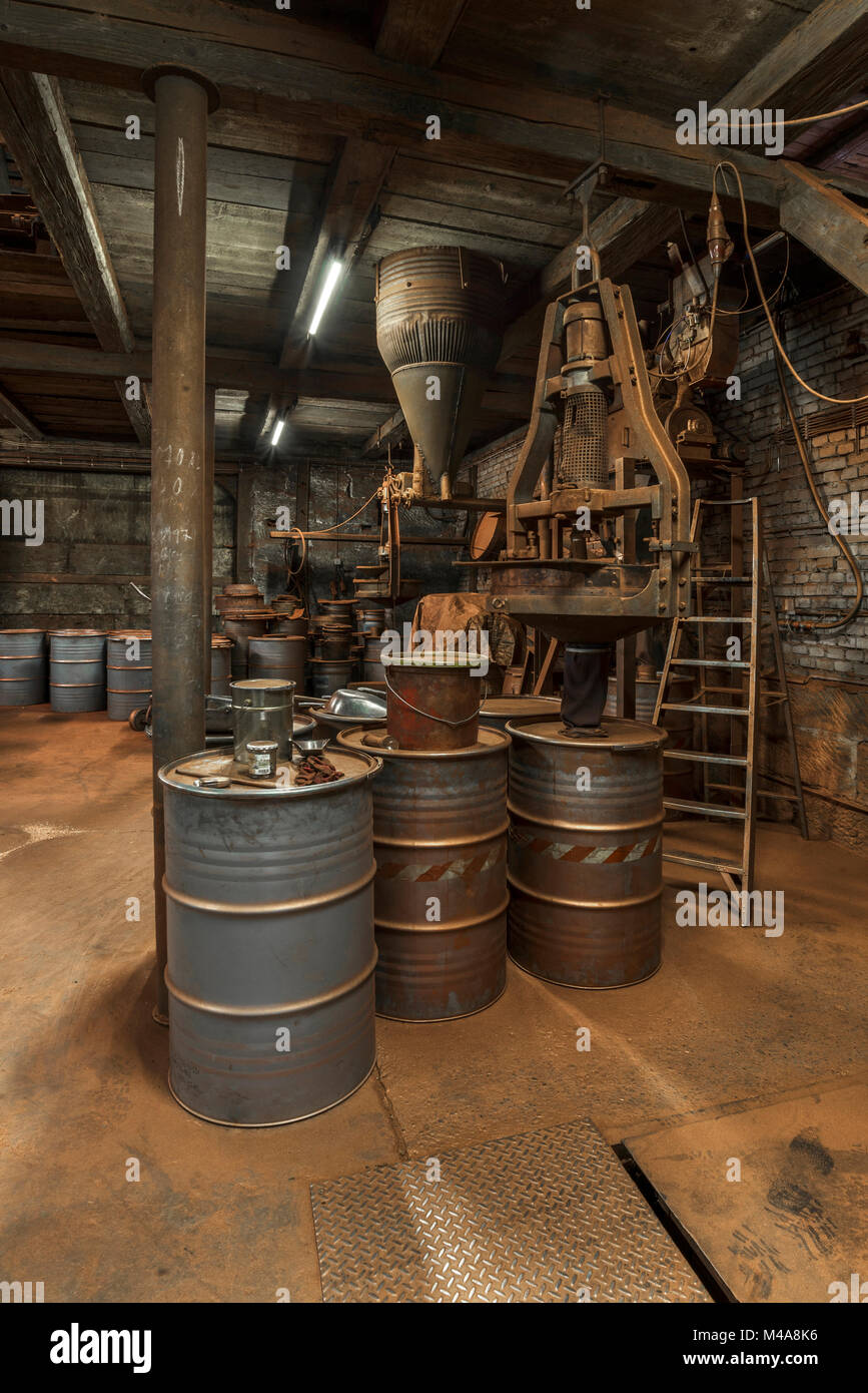 Production room for bronze powder with barrels and machines in a ...