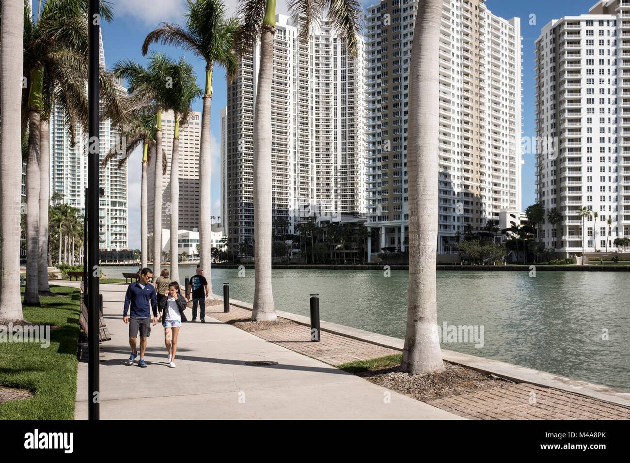 People walking along the waterfront in downtown Brickell, Miami ...