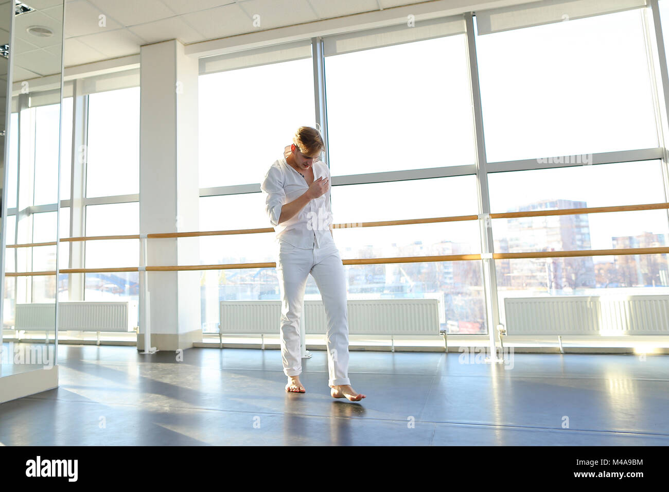Male dancer moves using street style elements Stock Photo - Alamy