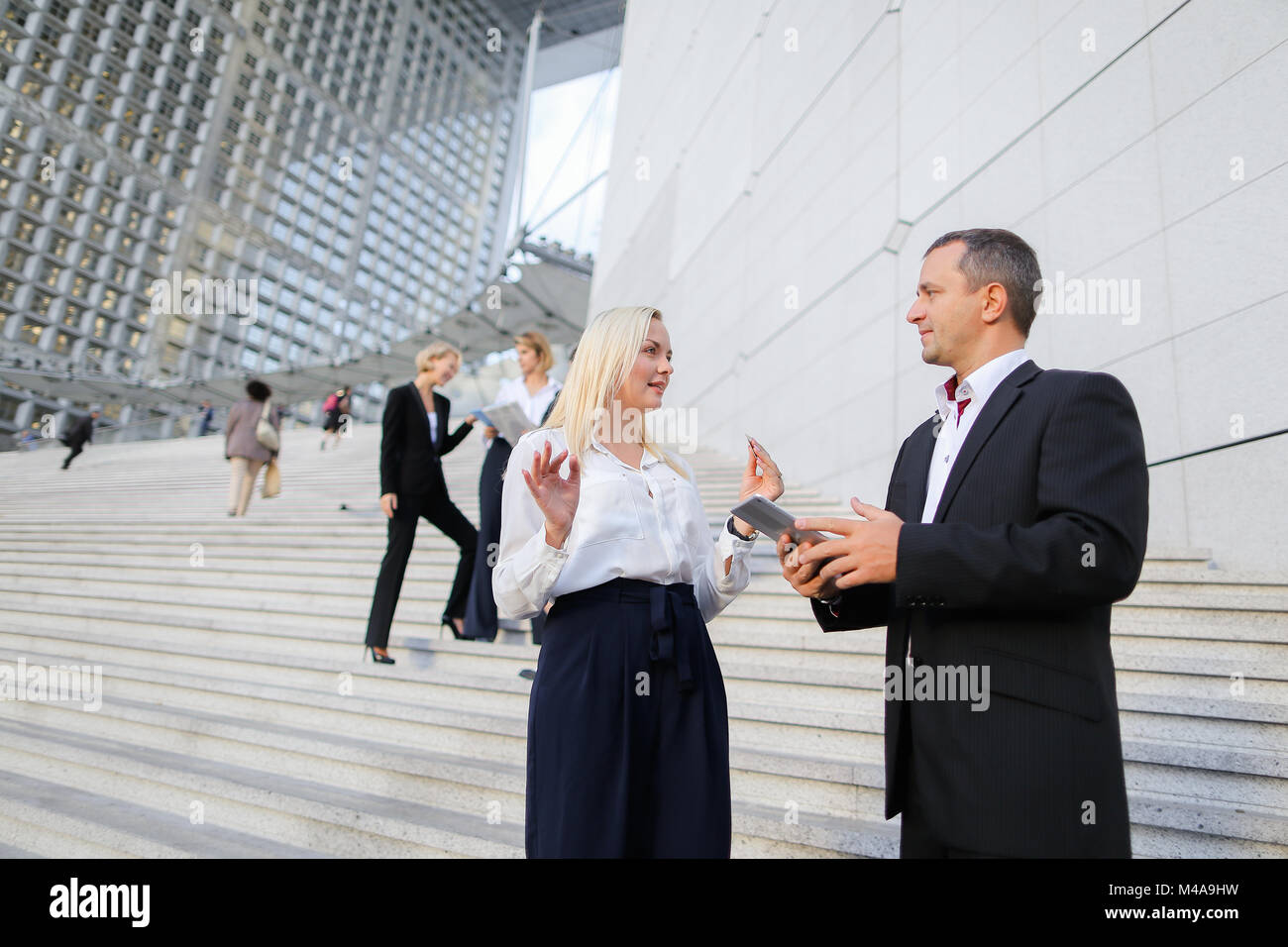 Foreign business colleagues in official journey talking and keep Stock ...