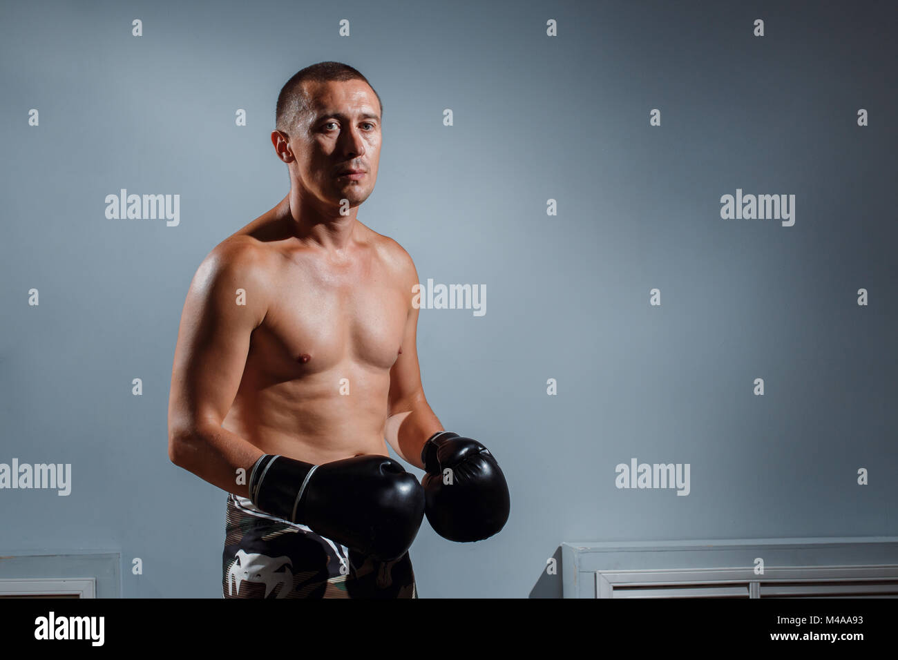 Young handsome man or healthy boxer or Thai boxer with six pack wearing ...