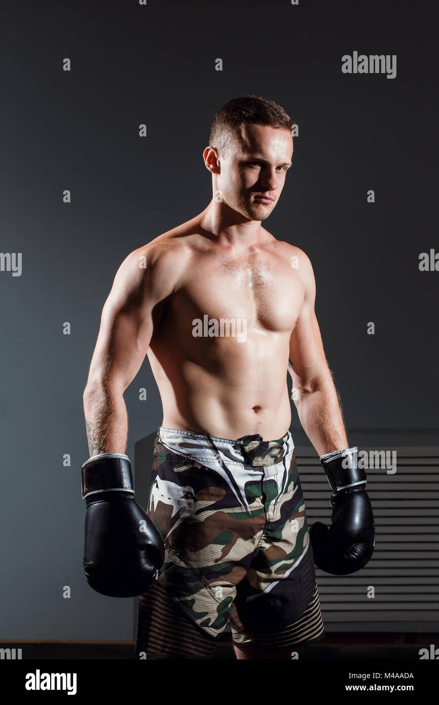 Young handsome man or healthy boxer or Thai boxer with six pack wearing ...