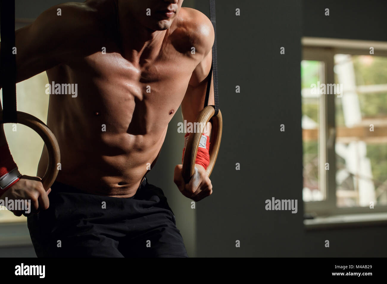 Fitness dip ring man workout at gym dipping exercise Stock Photo - Alamy