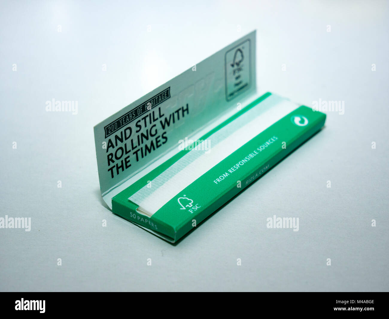 Rizzla green hand rolled cigarette papers Stock Photo - Alamy