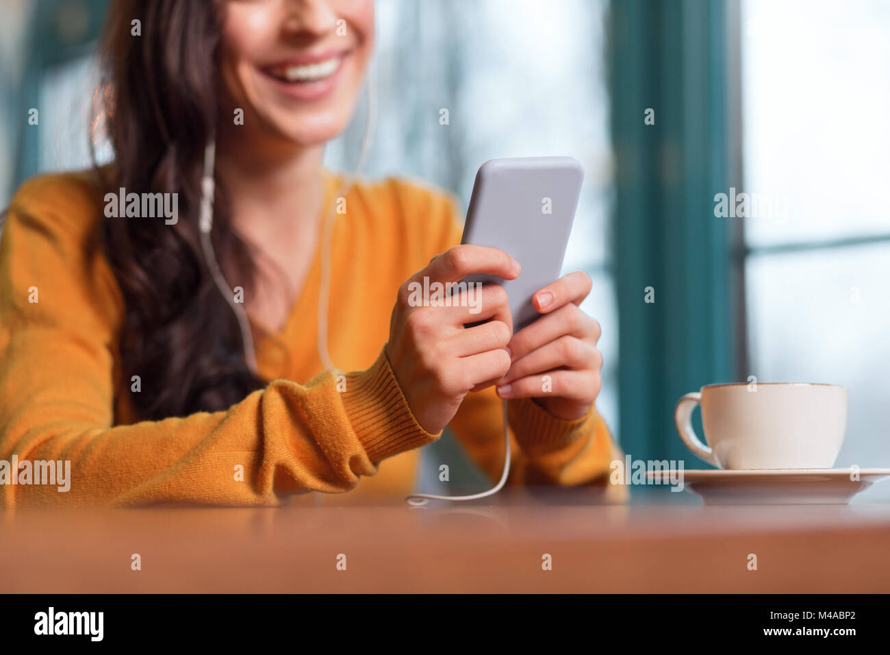Happy merry woman typing messages Stock Photo - Alamy