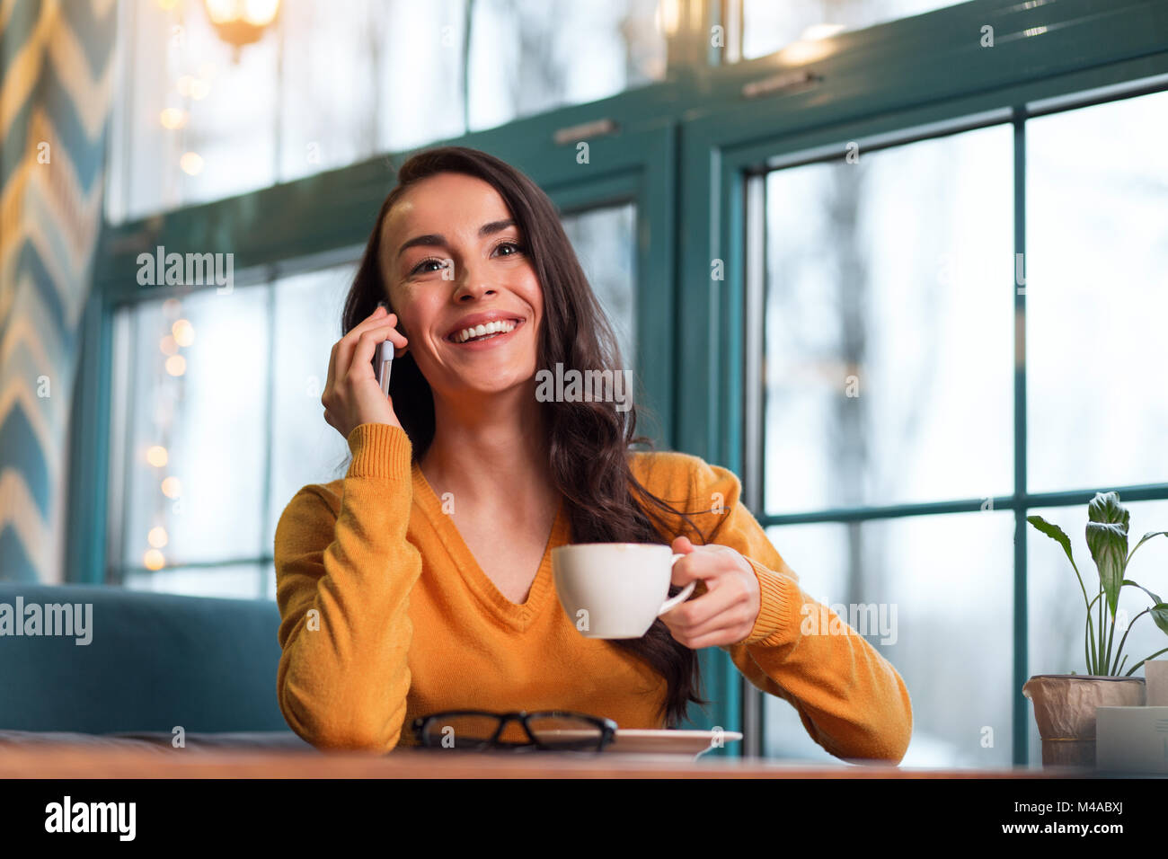Jolly woman on phone hi-res stock photography and images - Alamy